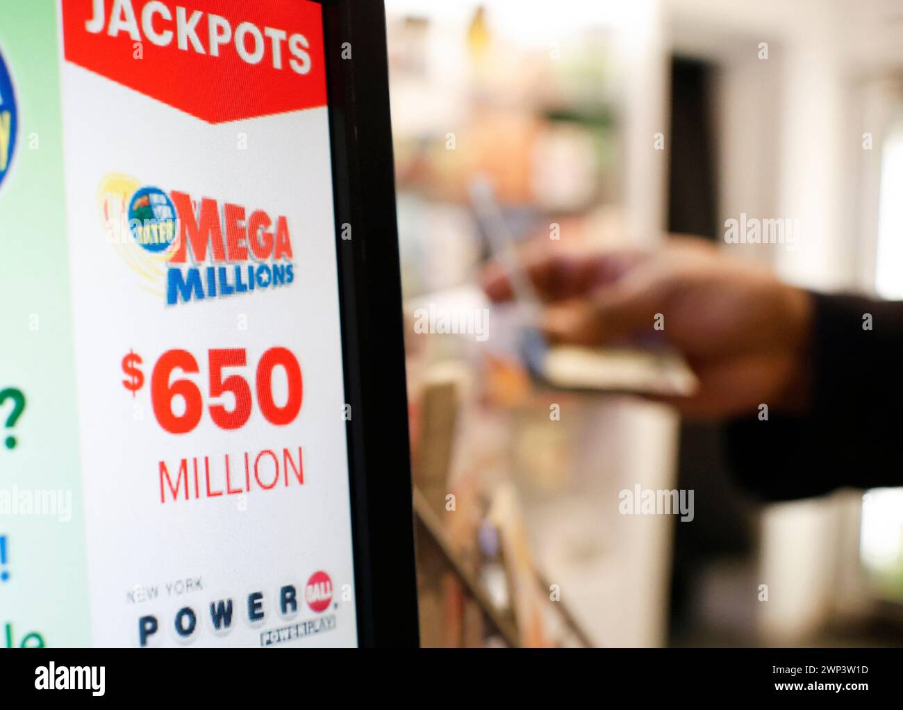New York, United States. 04th Mar, 2024. A customer makes a lottery ...