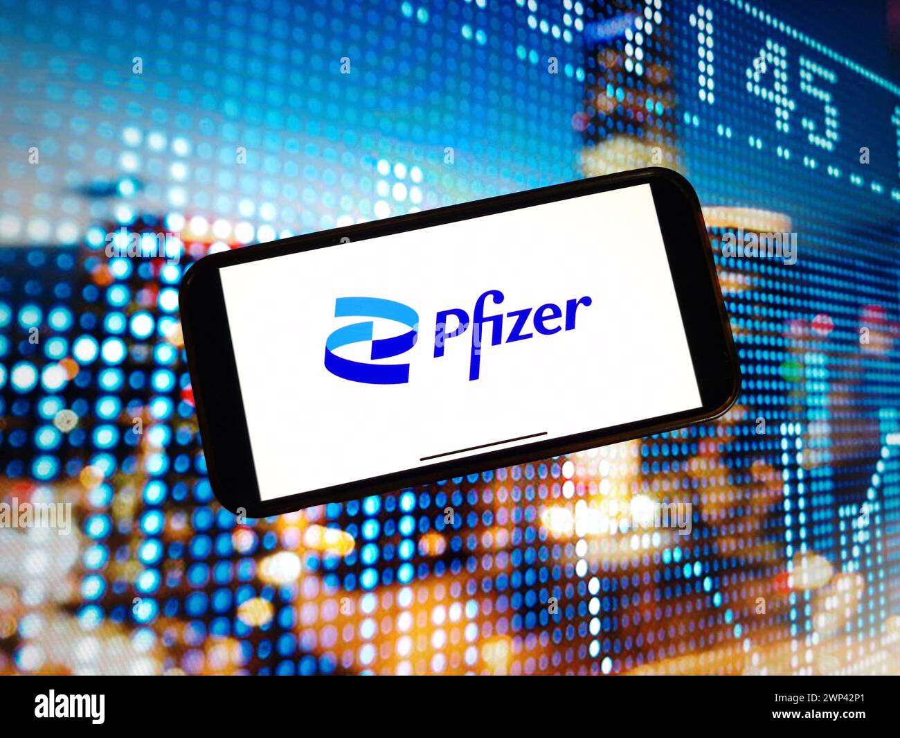 In this photo illustration, the Pfizer company logo is seen displayed ...