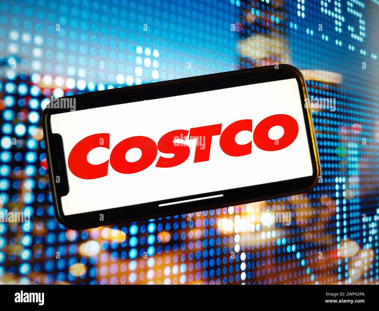 In this photo illustration, the Costco Wholesale Corporation logo is ...