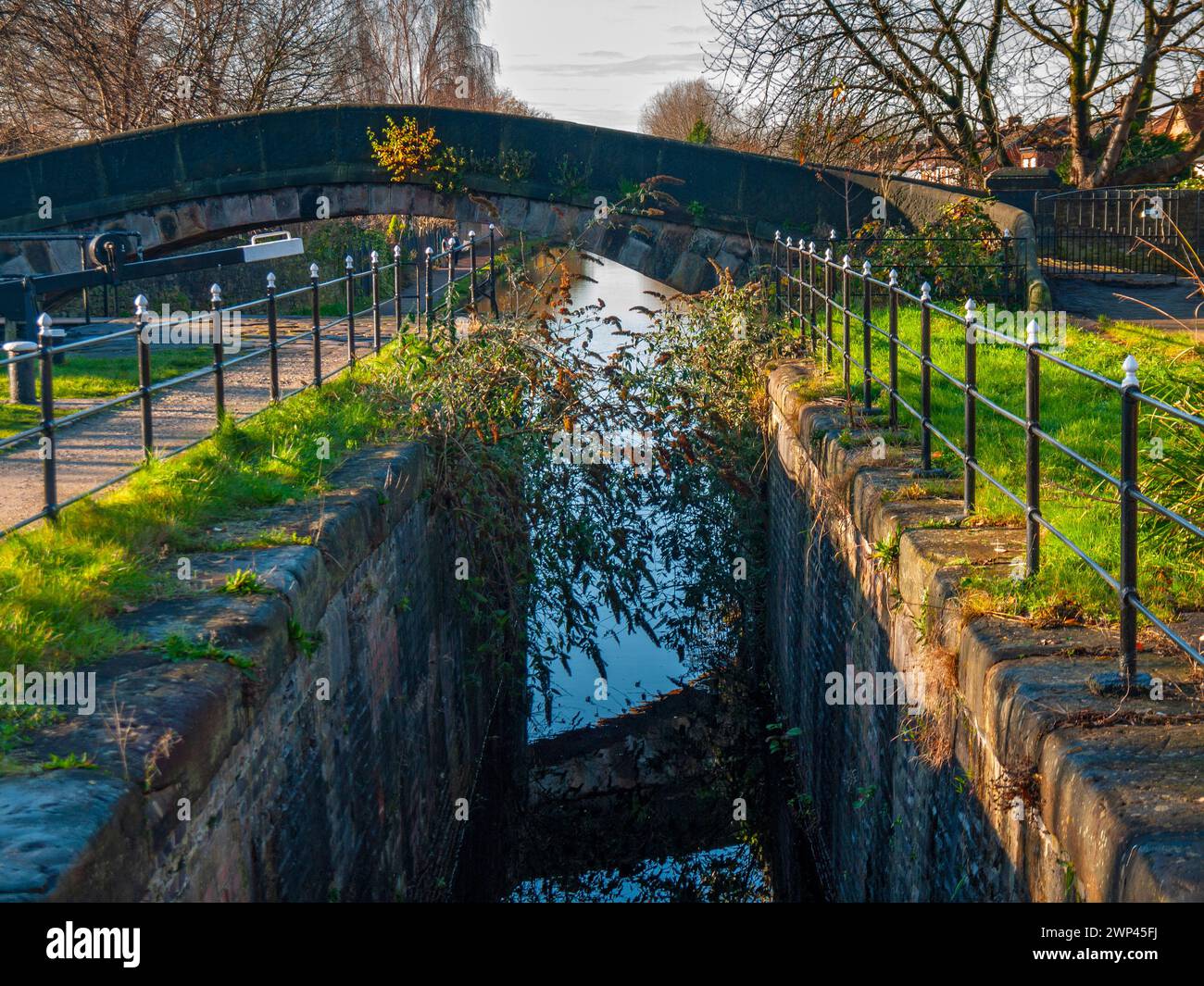 Stone footbridge at Fairfield Locks (Lock 18) on the Ashton Canal ...