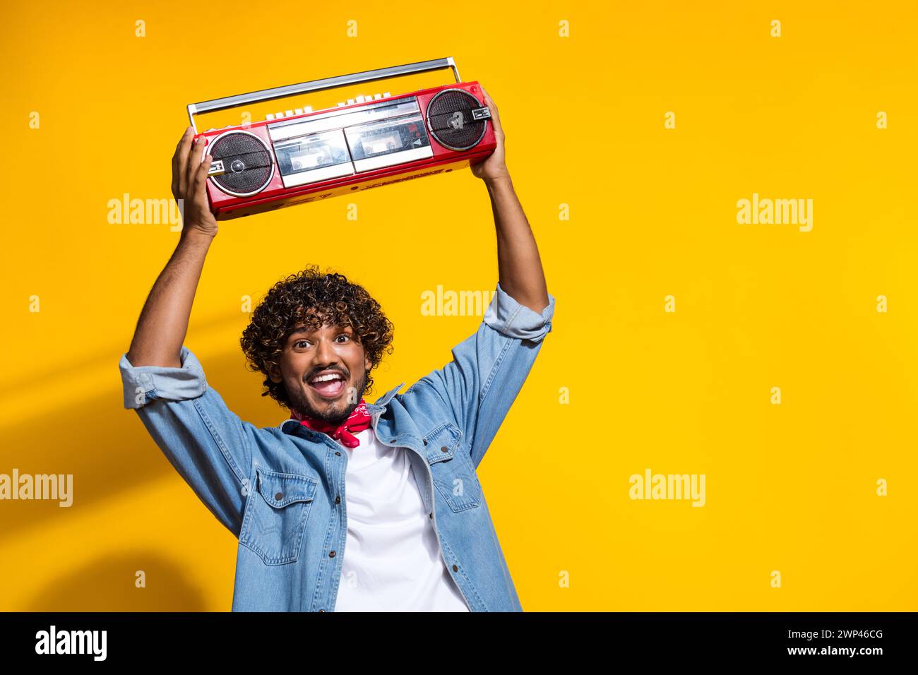 Photo portrait of attractive young man raise hip hop boombox dressed ...