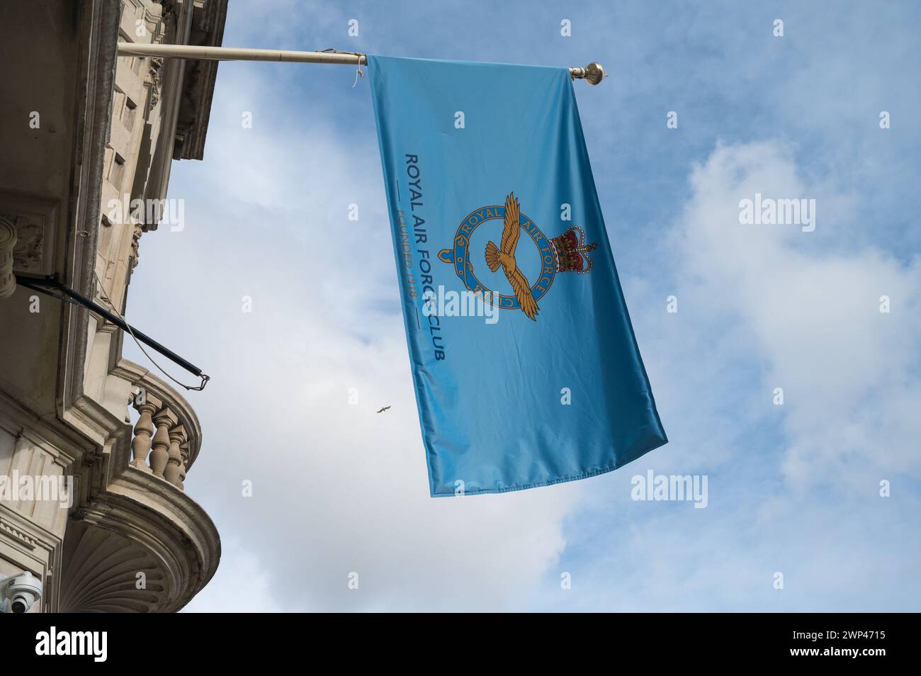 Flag mounted above the entrance facade of the Royal Air Force Club ...