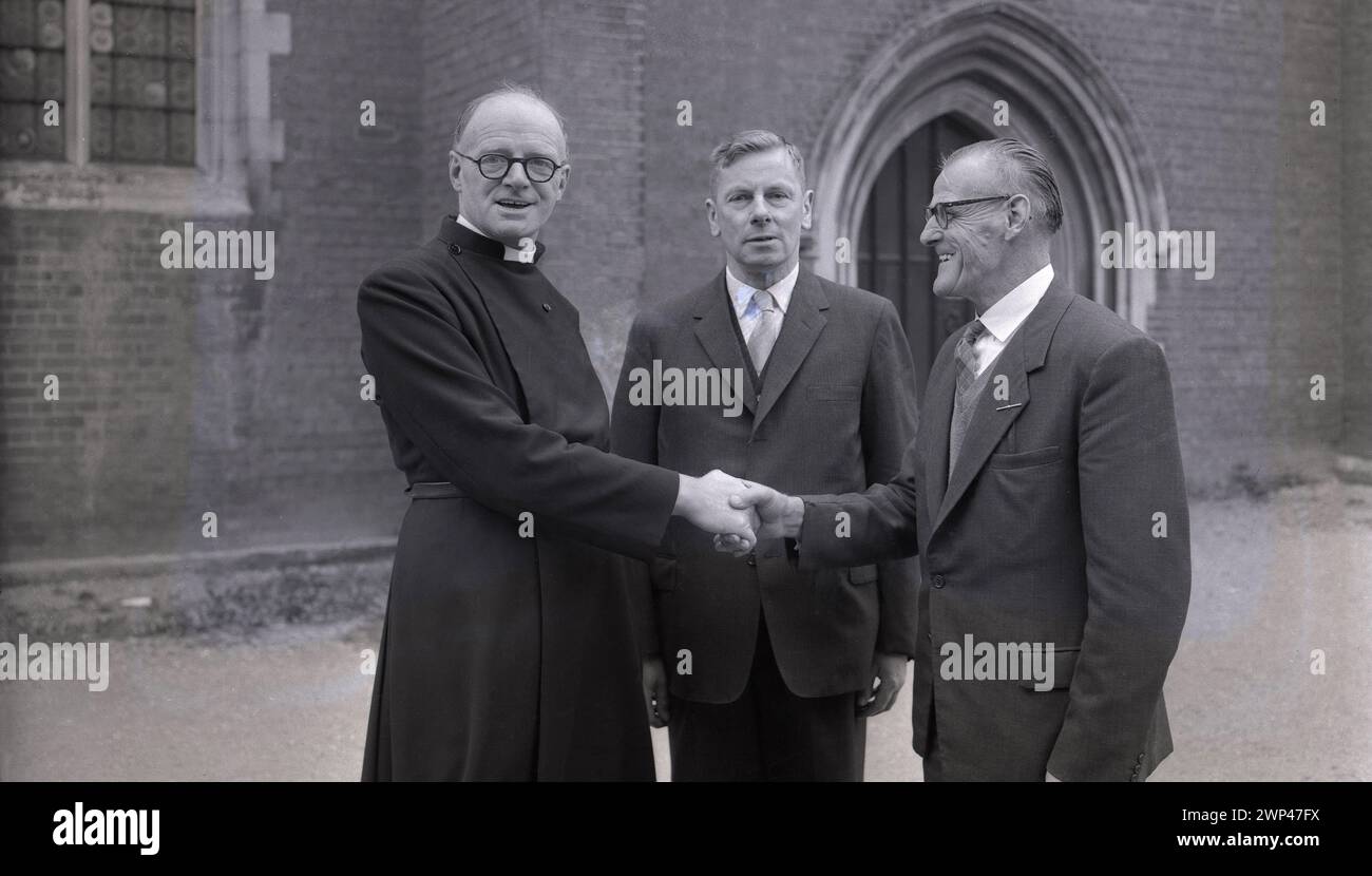 1950s, historical, an English clergyman, Reverend A. S Wye, outside the ...