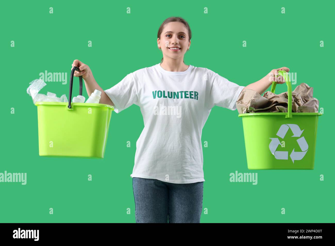 Female volunteer with trash bins on green background. Waste sorting ...