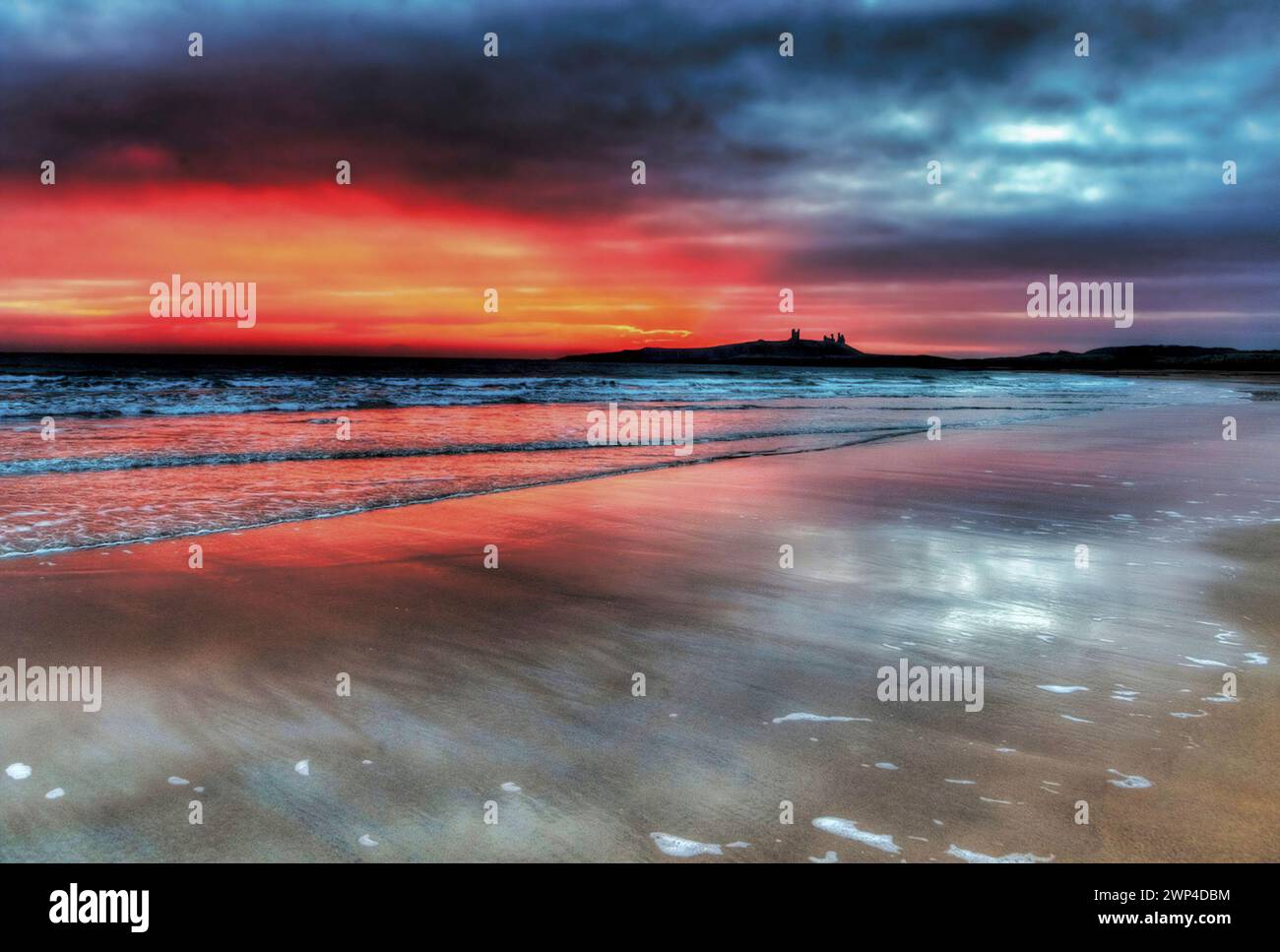Dunstanburgh Castle from Embleton beach Stock Photo - Alamy