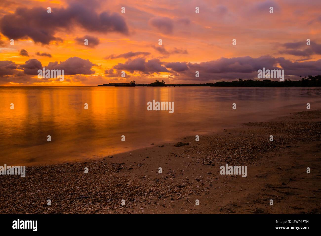 Beautiful sunset over ocean water taken from a beach in Guam Stock ...