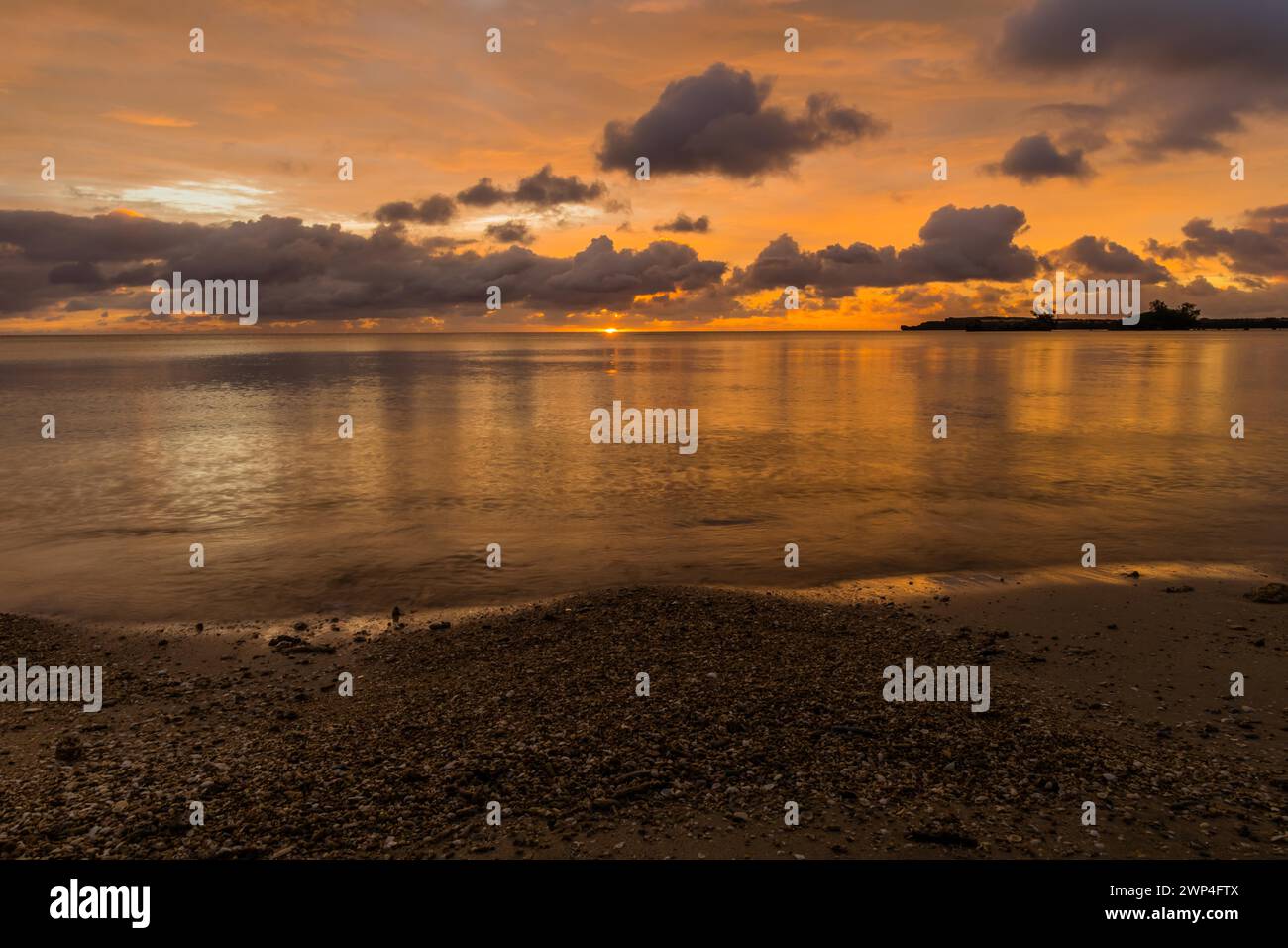 Beautiful sunset over ocean water taken from a beach in Guam Stock ...