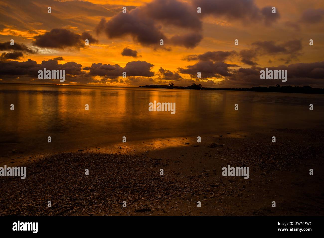 Beautiful sunset over ocean water taken from a beach in Guam Stock ...