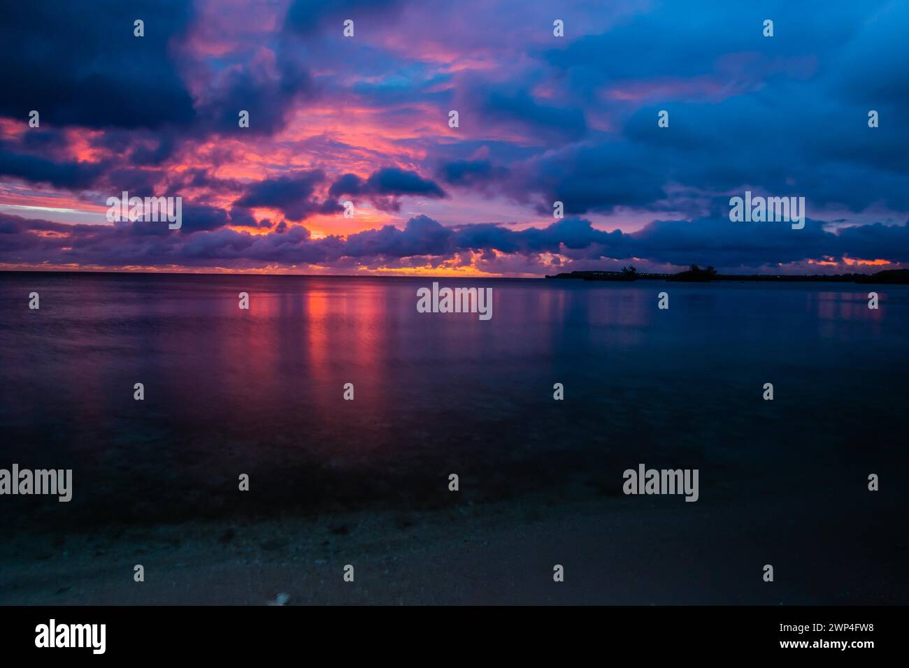 Beautiful sunset over ocean water taken from a beach in Guam Stock ...