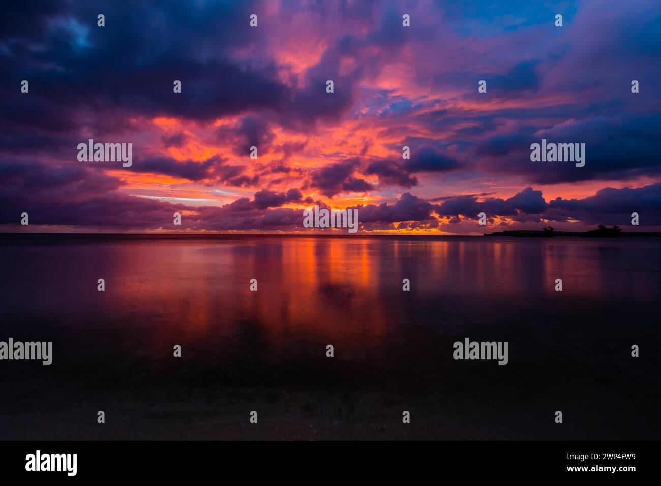 Beautiful sunset over ocean water taken from a beach in Guam Stock ...