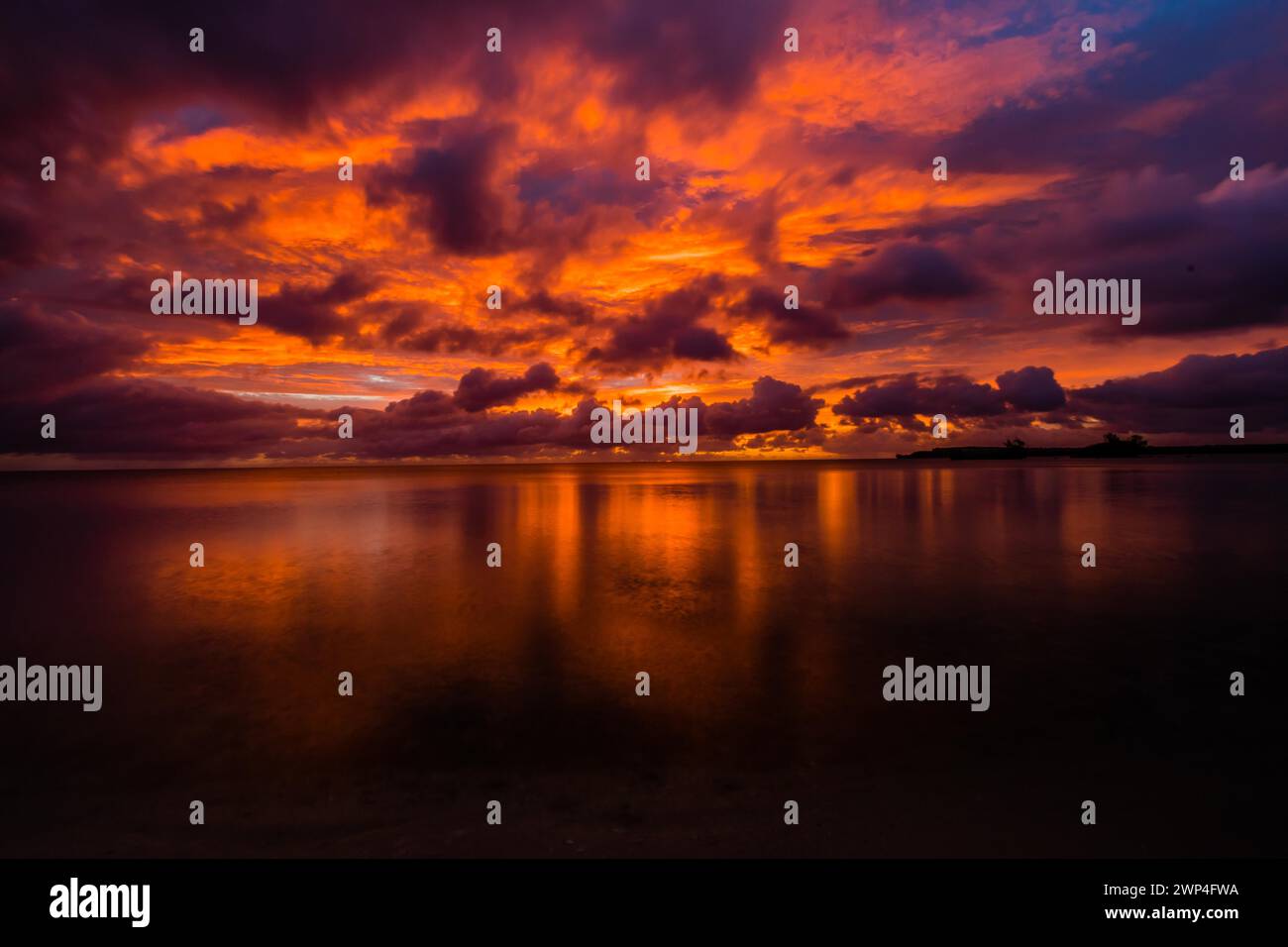 Beautiful sunset over ocean water taken from a beach in Guam Stock ...