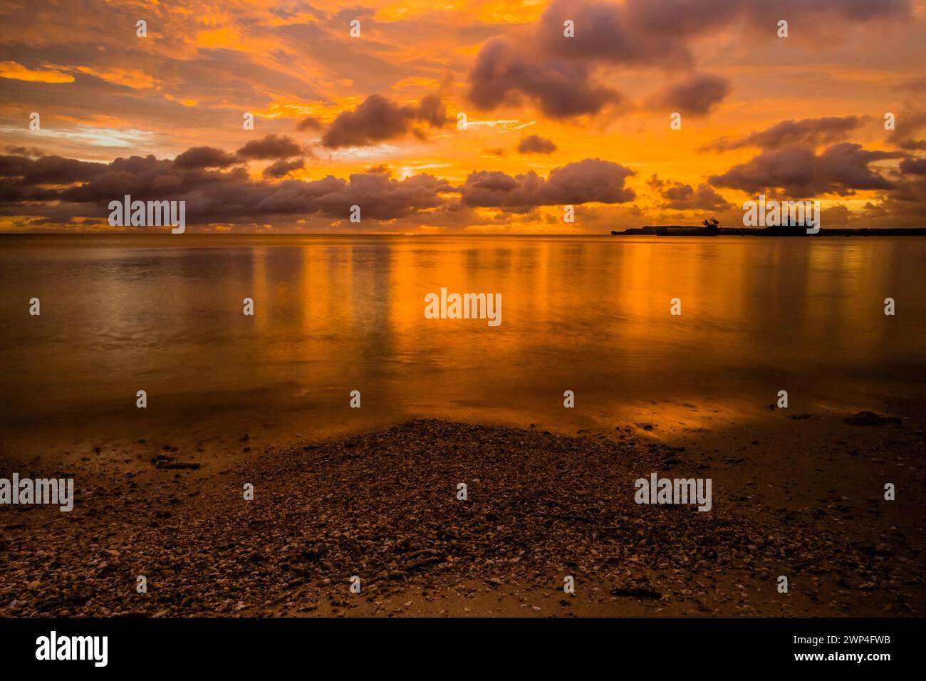 Beautiful sunset over ocean water taken from a beach in Guam Stock ...
