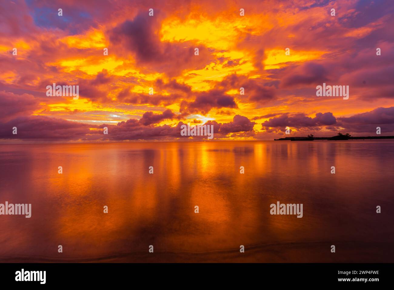 Beautiful sunset over ocean water taken from a beach in Guam Stock ...