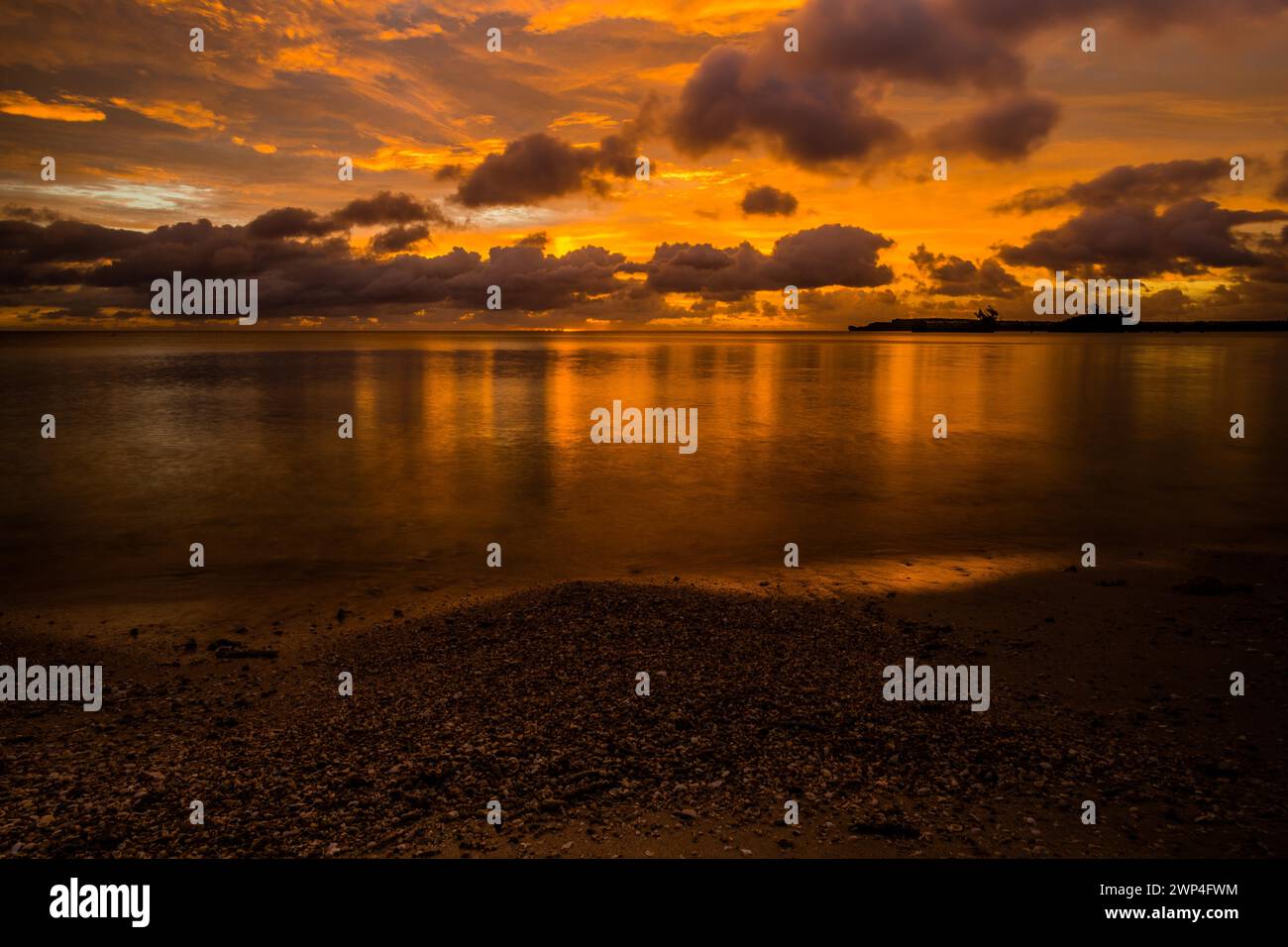 Beautiful sunset over ocean water taken from a beach in Guam Stock ...