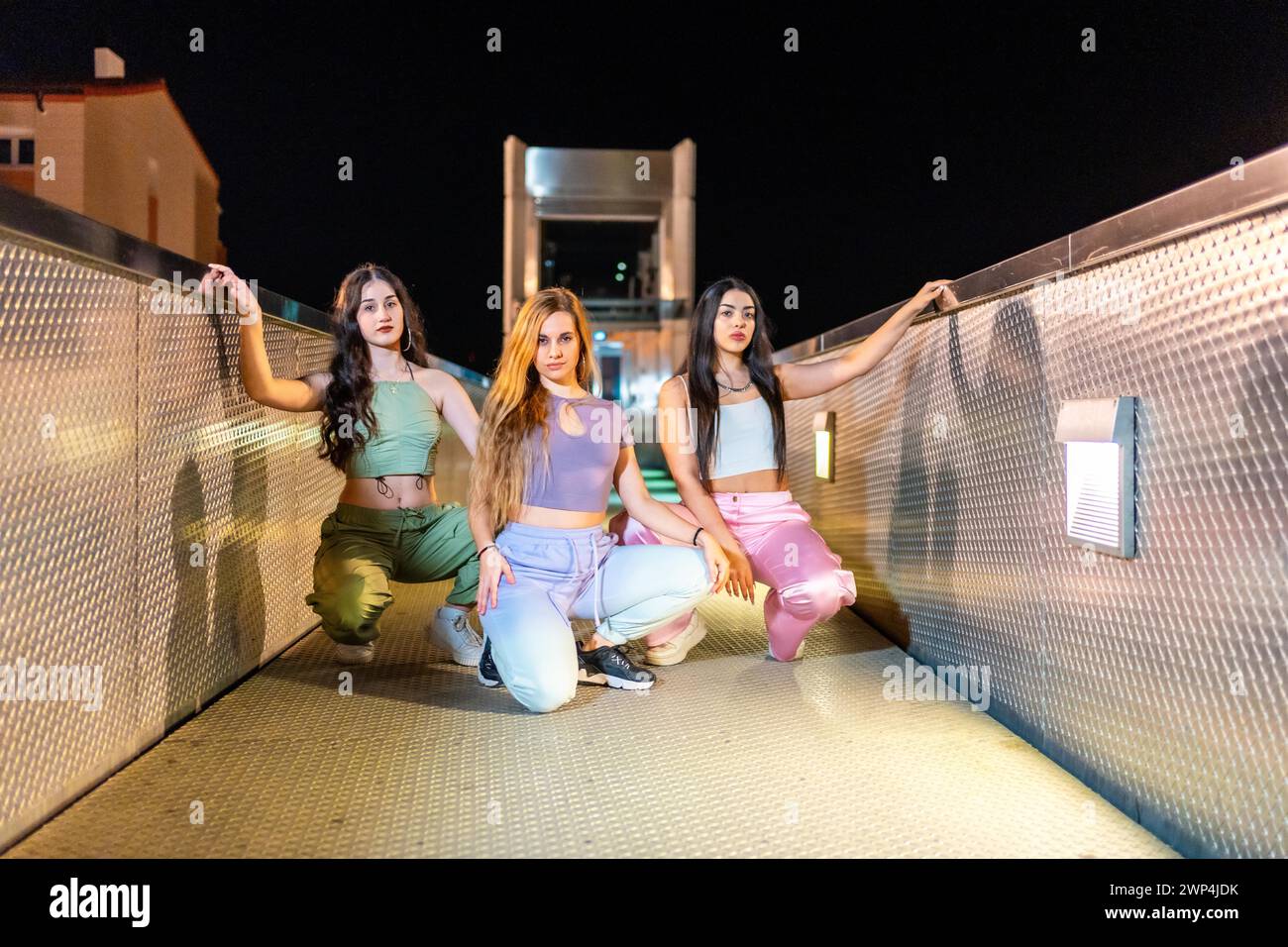 Frontal portrait of an alternative group of young and cool hip hop ...