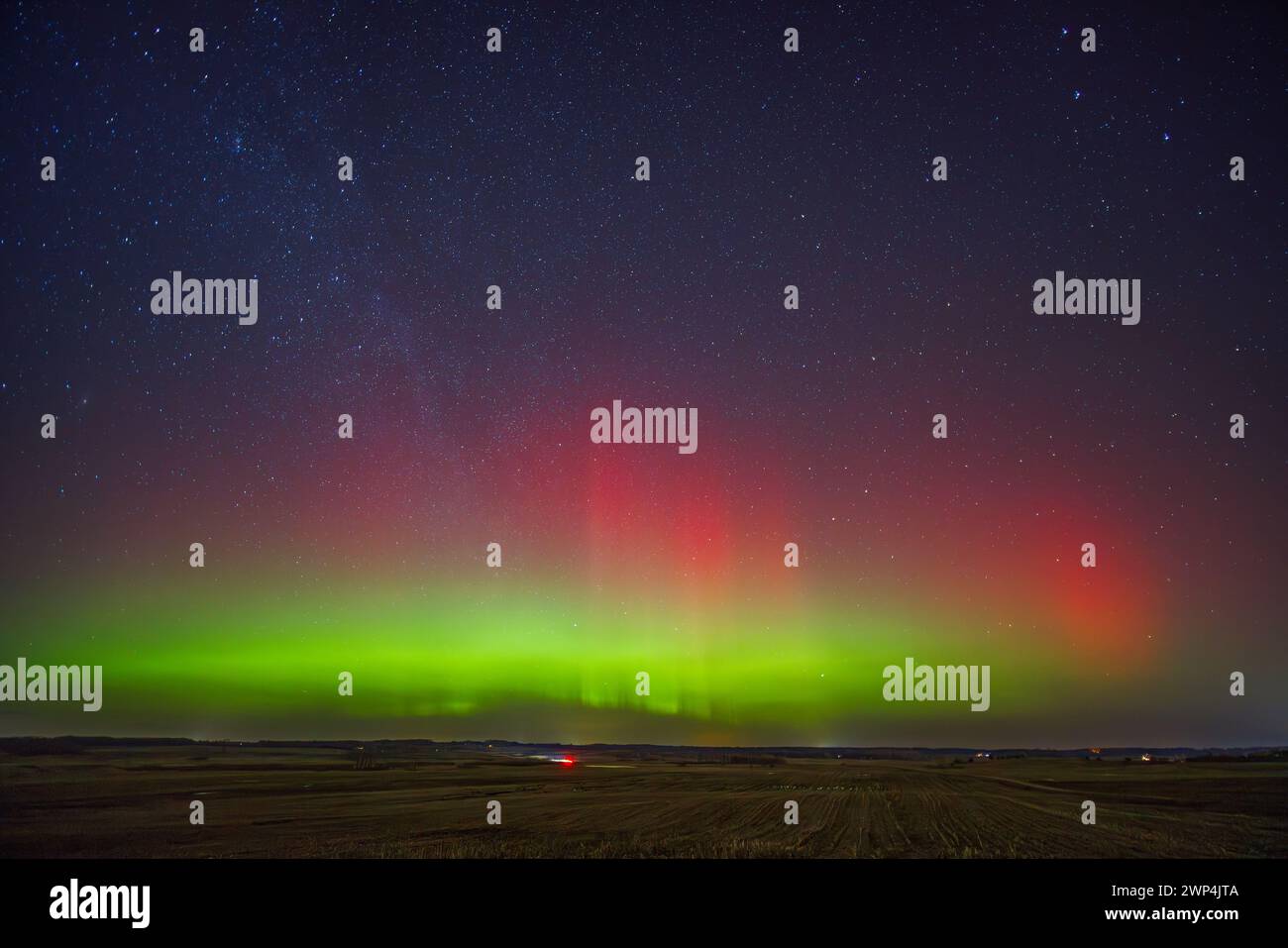 Northern lights - Aurora borealis dancing in the night sky Stock Photo ...