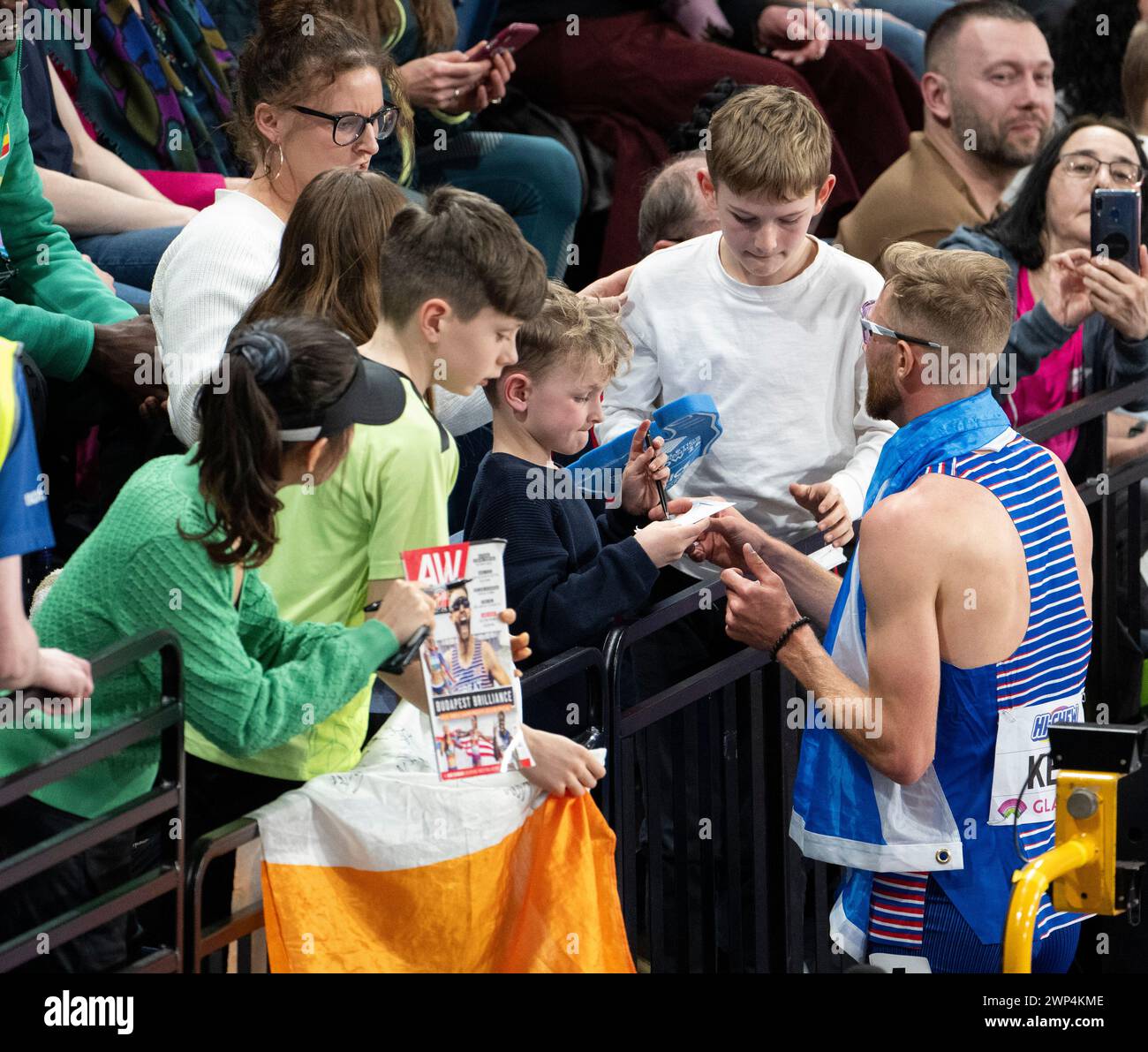 Josh Kerr signing autographs for the children after winning the 3000m ...