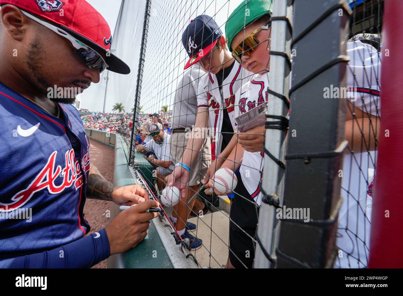 Atlanta Braves catcher Chadwick Tromp sings autographs before a spring ...