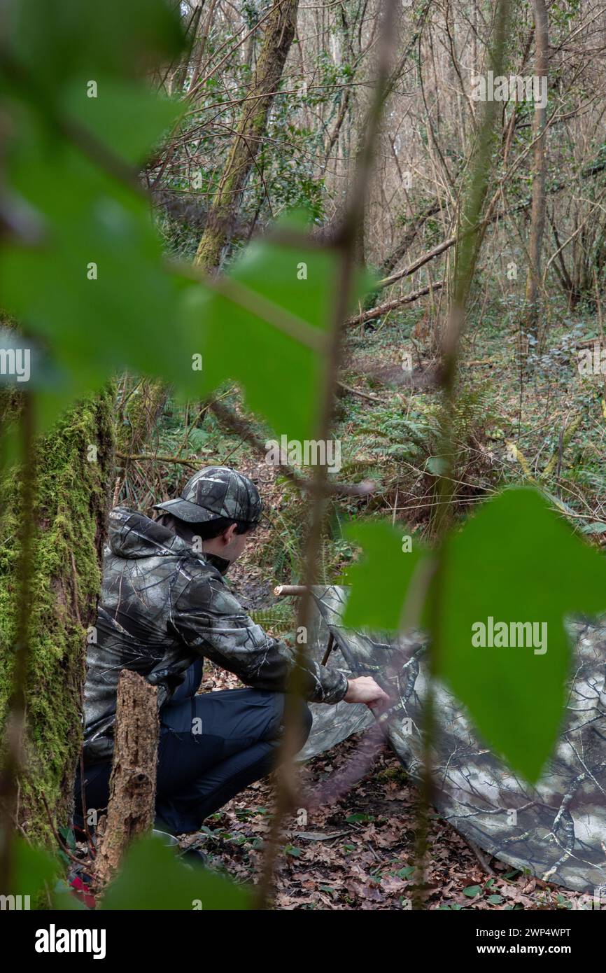 vertical portrait Through the thick foliage of the forest, the figure ...