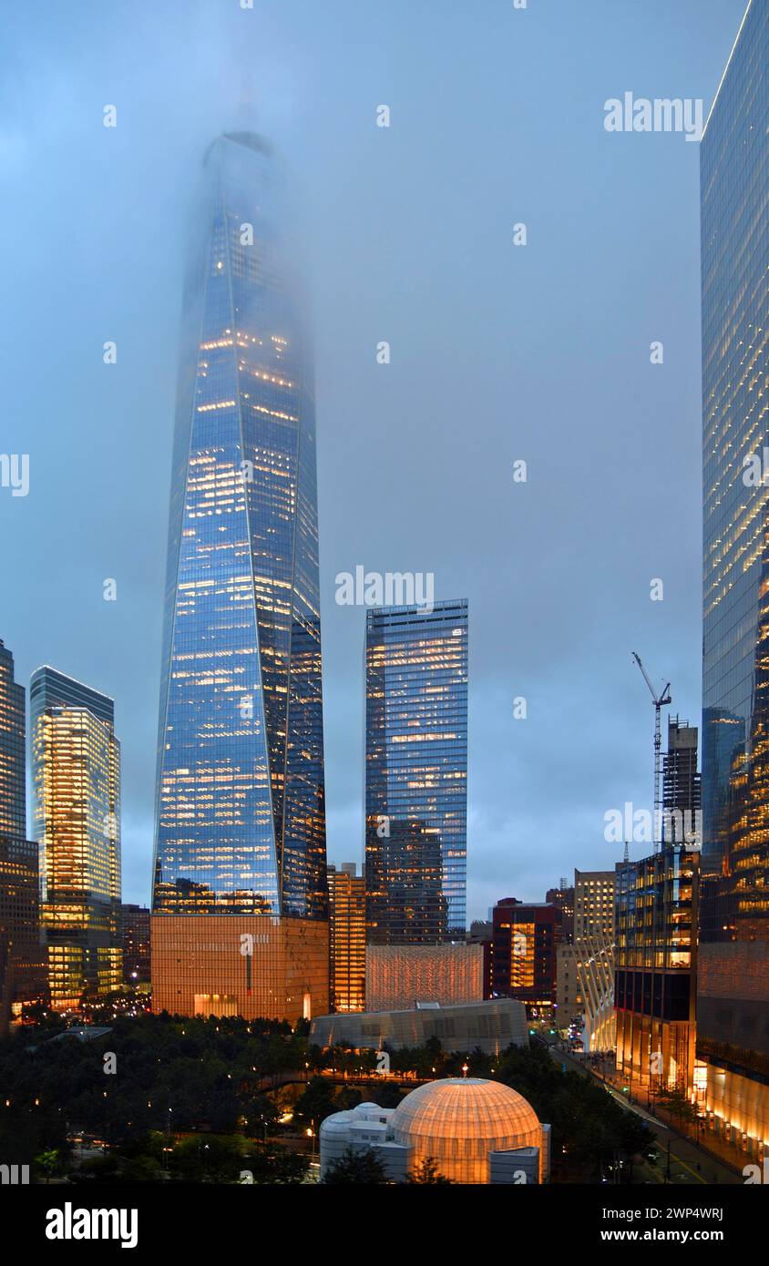 Skyscraper One World Trade Centre or Freedom Tower at the top shrouded ...