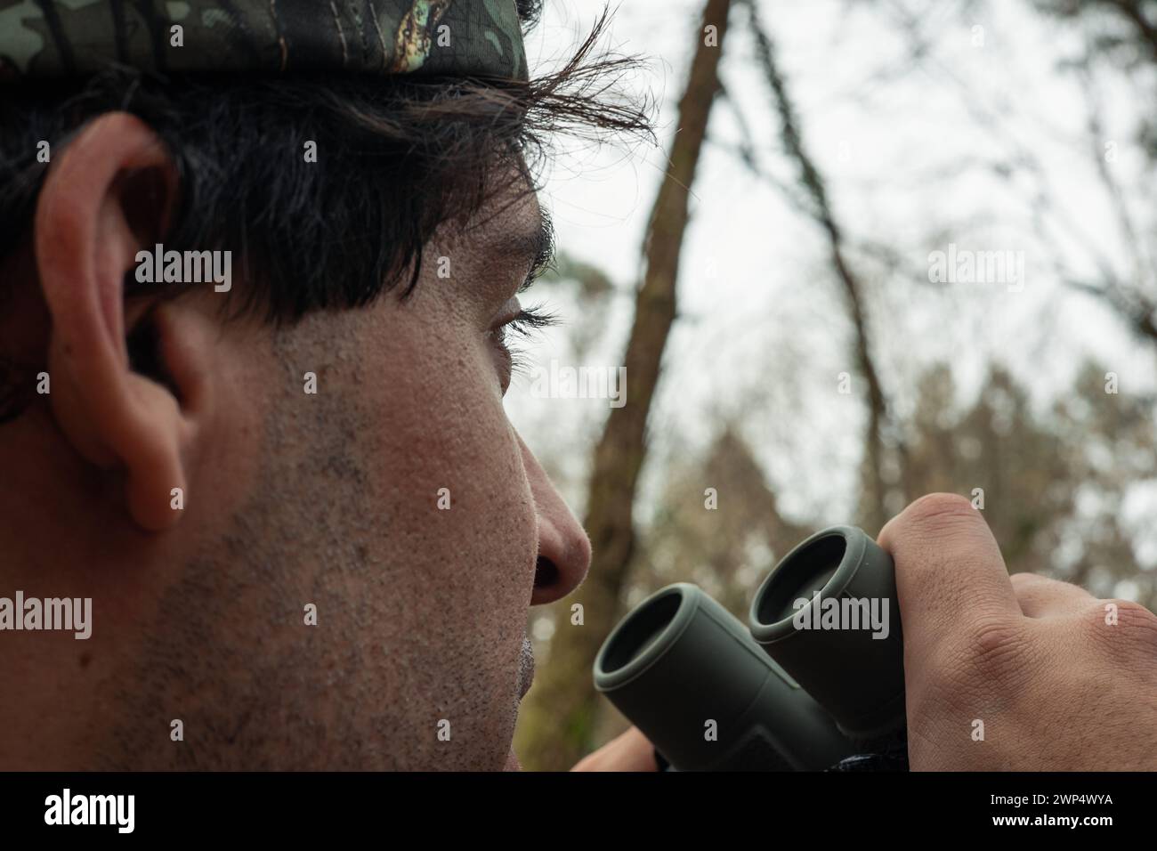 In this captivating close-up, a forest ranger stands as the guardian of ...