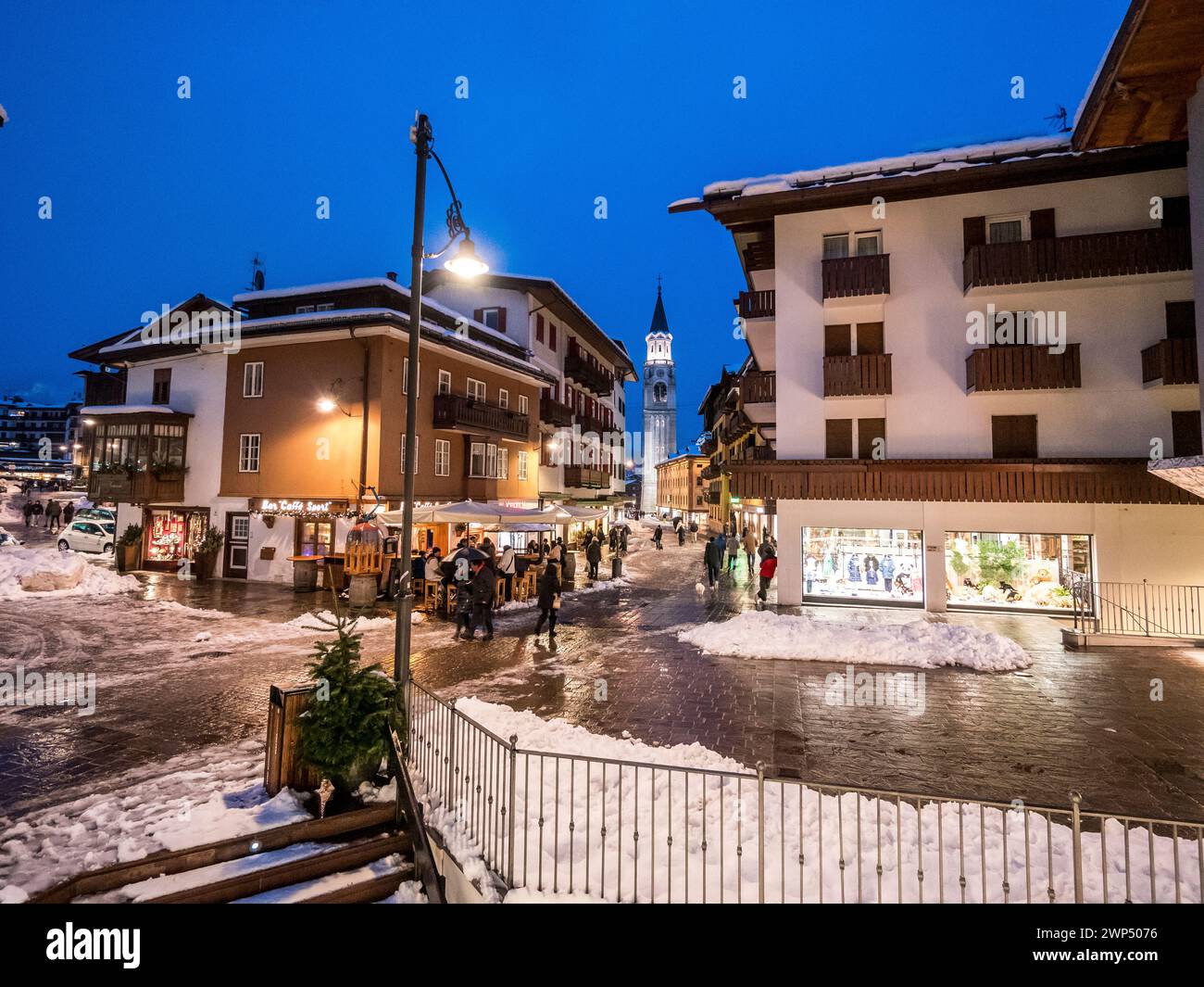The image is of a winter night-time street scene in the resort town of ...