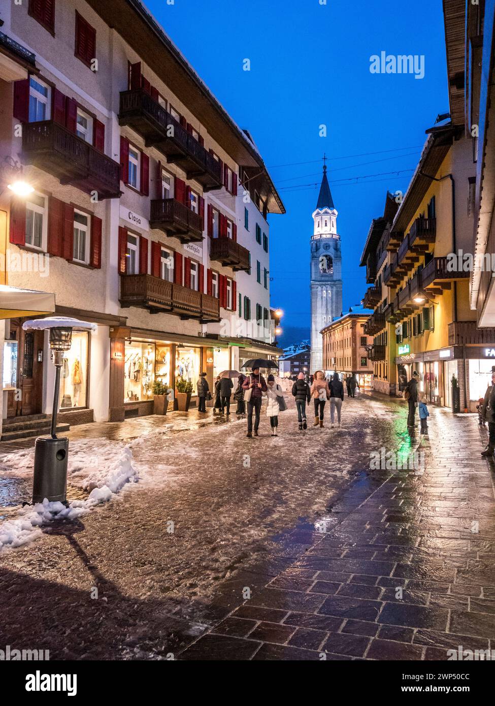 The image is of a winter night-time street scene in the resort town of ...
