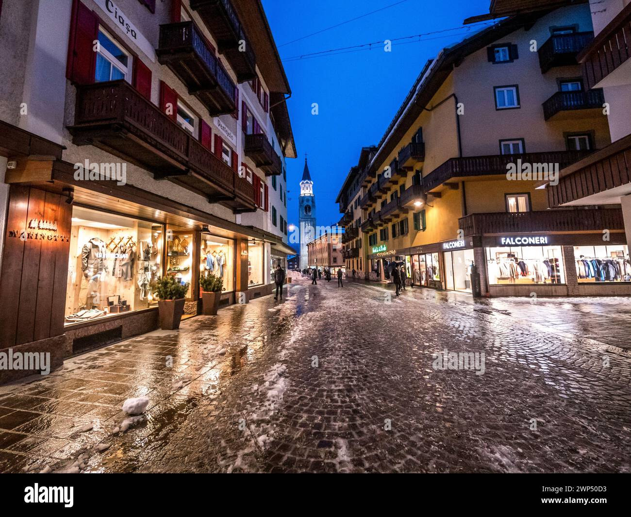 The image is of a winter night-time street scene in the resort town of ...