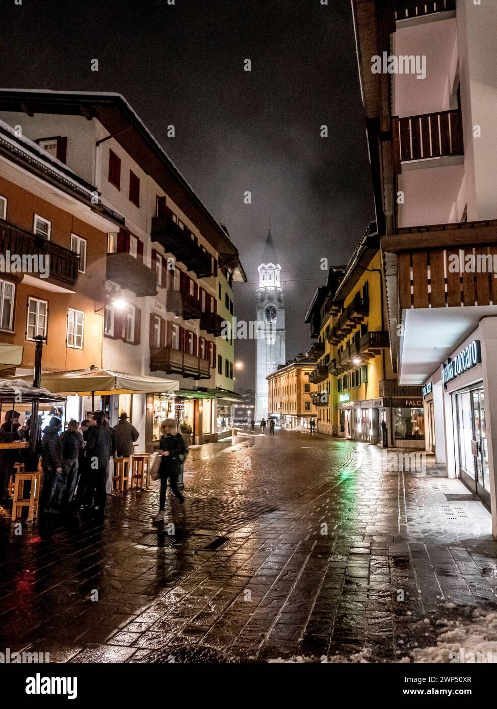 The image is of a winter night-time street scene in the resort town of ...