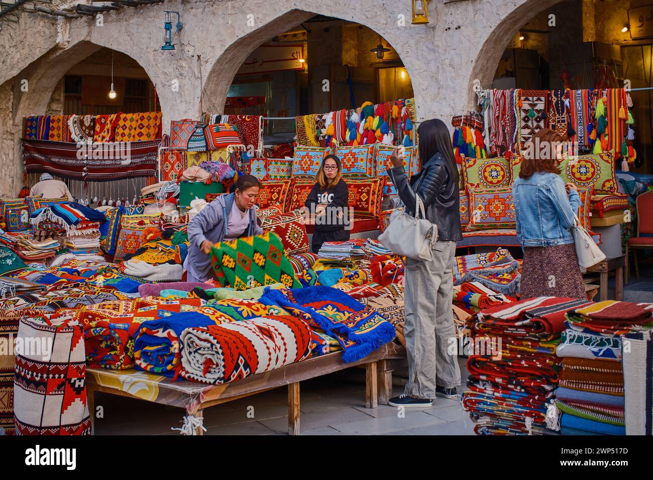 Souq Waqif Doha, Qatar Main street afternoon shot showing Traditional Arabic Textile shop ...