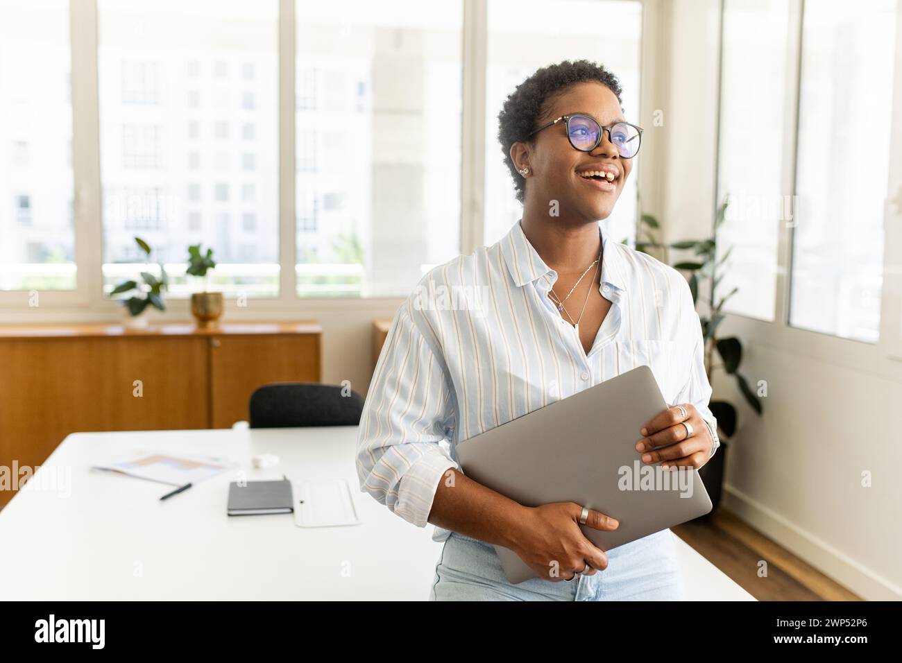 Successful cheerful inspired young african-american female entrepreneur ...