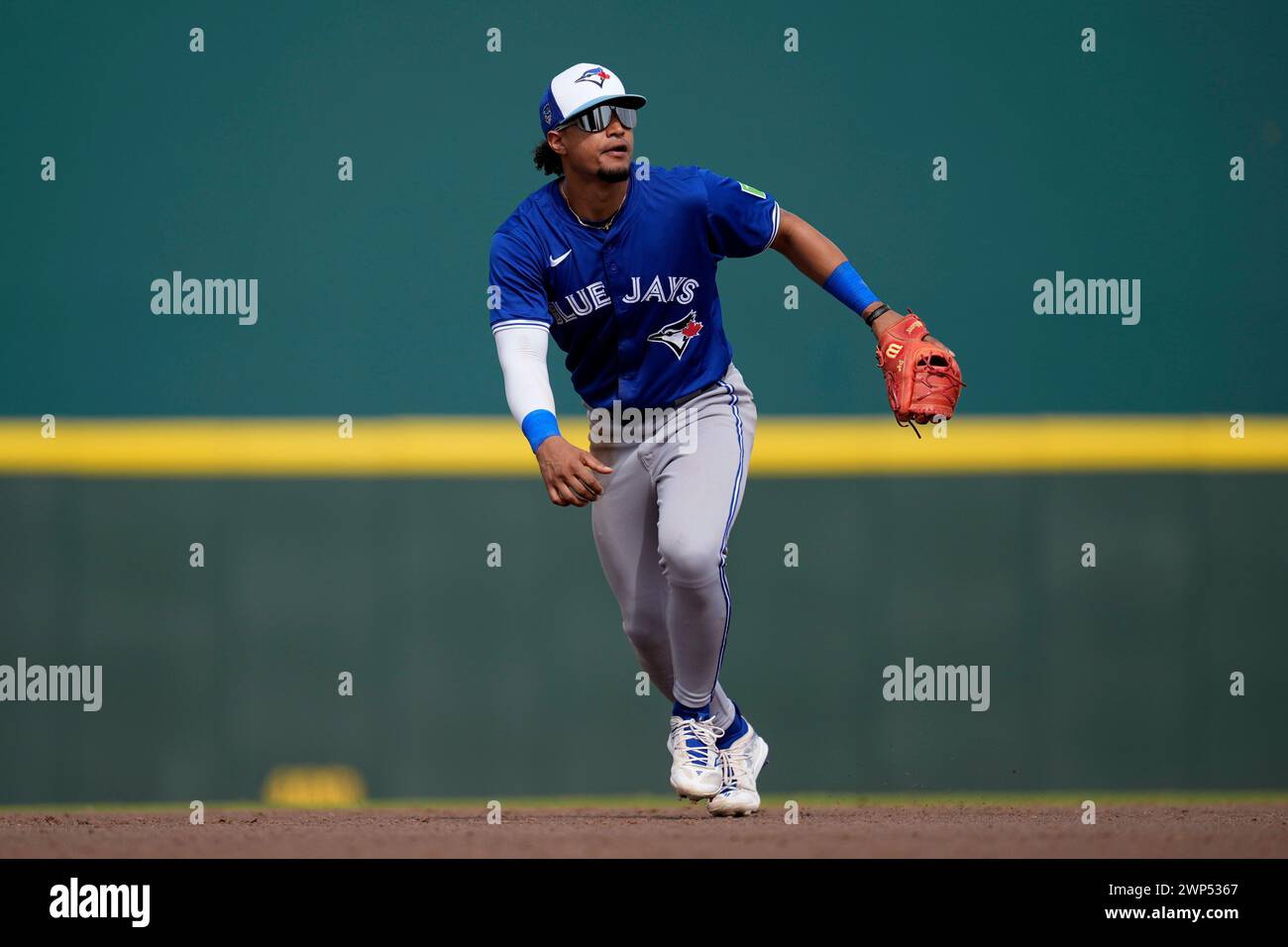 Toronto Blue Jays third baseman Santiago Espinal watches a fly ball in ...