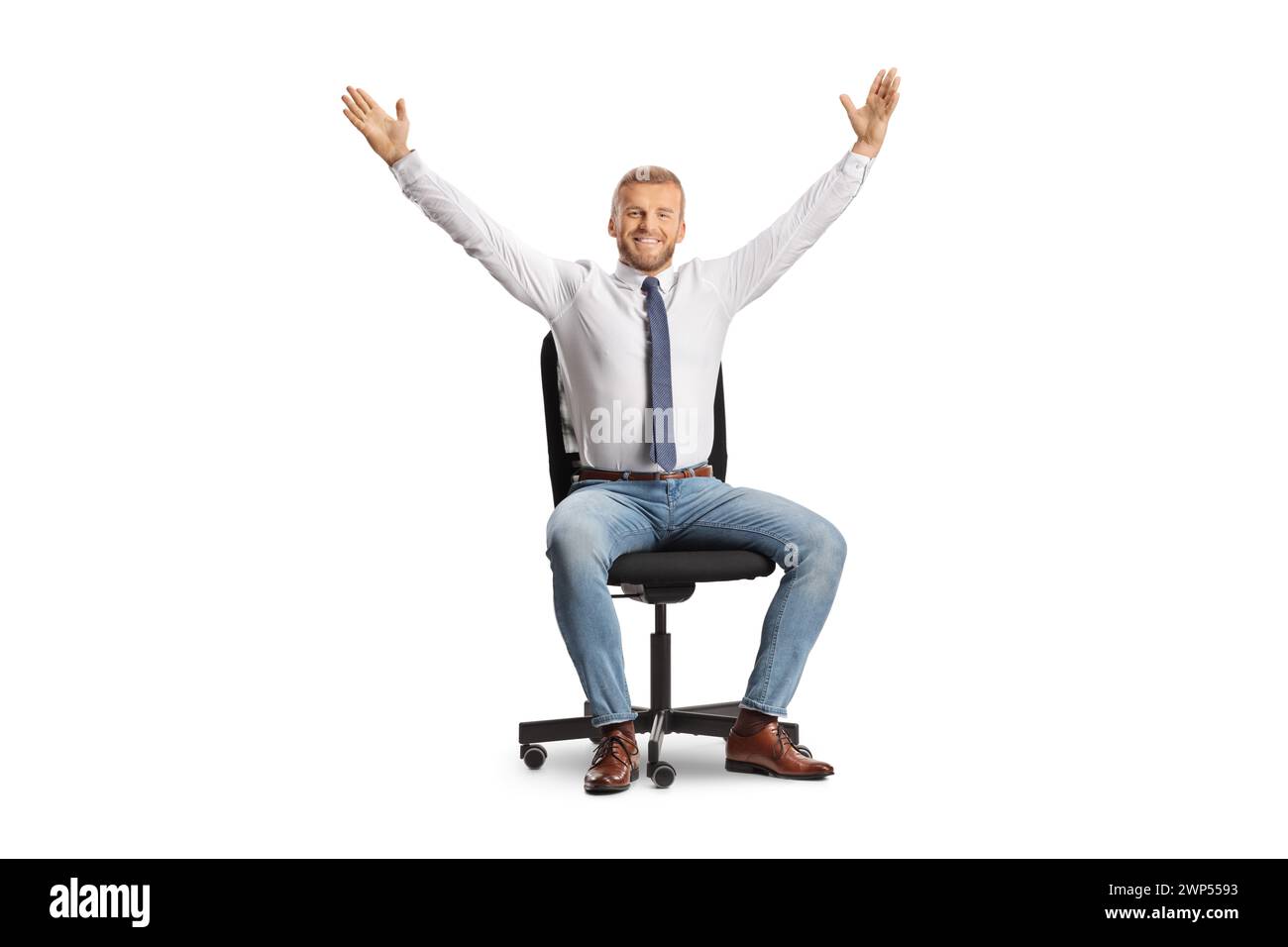 Happy man sitting in an office chair and raising arms isolated on white ...