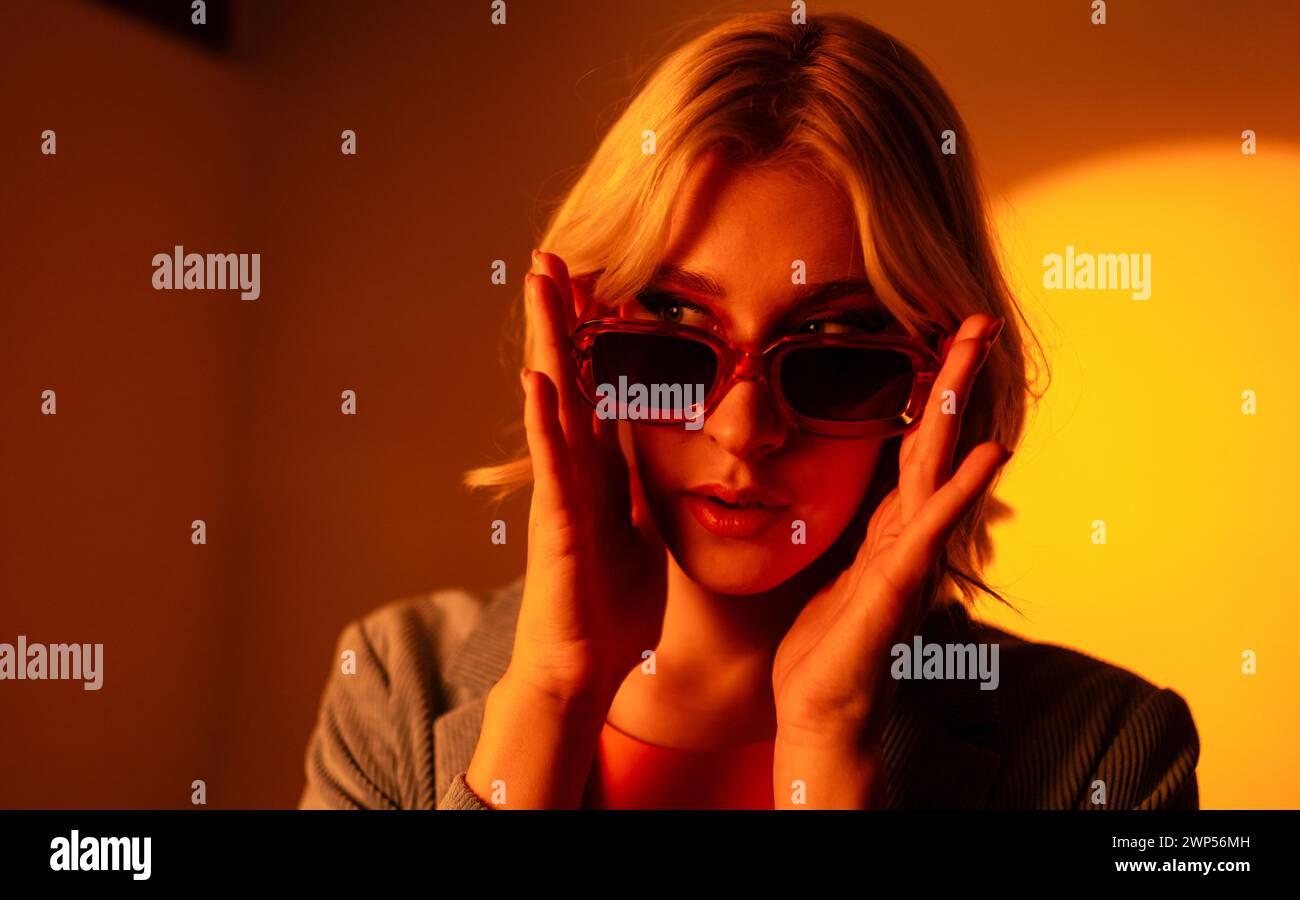 Female model posing with sunglasses covering the face Stock Photo - Alamy