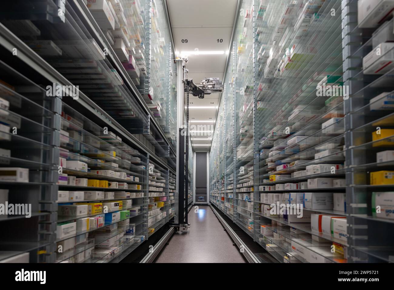 Photography of a pharmacy storage room and a robot hand are arranging ...