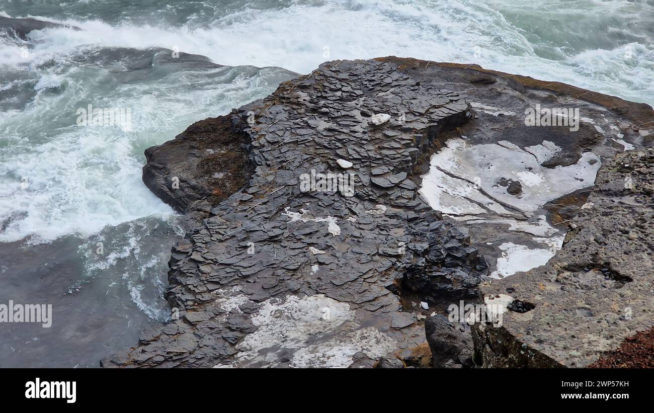 Huge water stream running down hills forming beautiful scenic route in ...