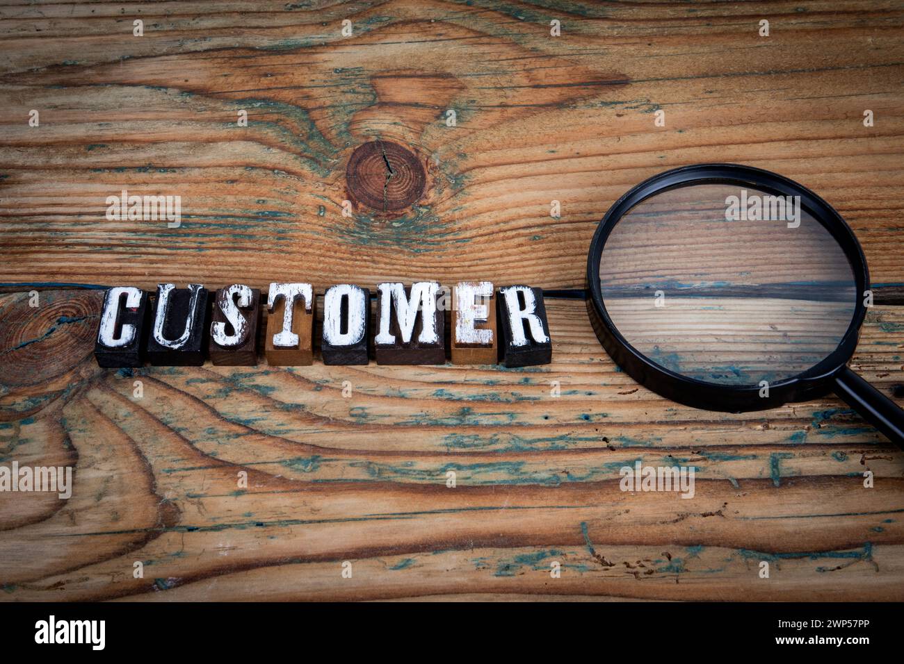CUSTOMER. Alphabet letters on wood texture background Stock Photo - Alamy