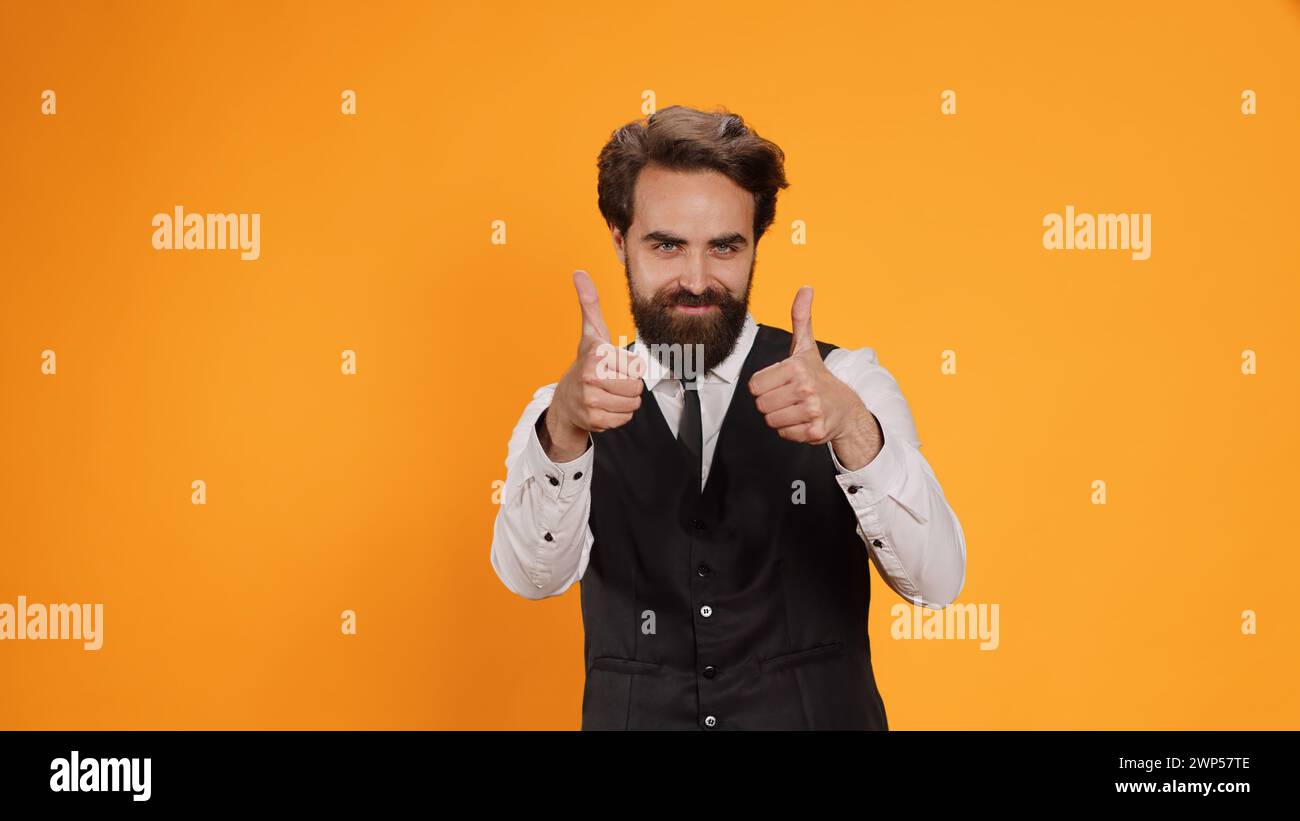 Confident worker does thumbs up sign, acting positive and cheerful in ...