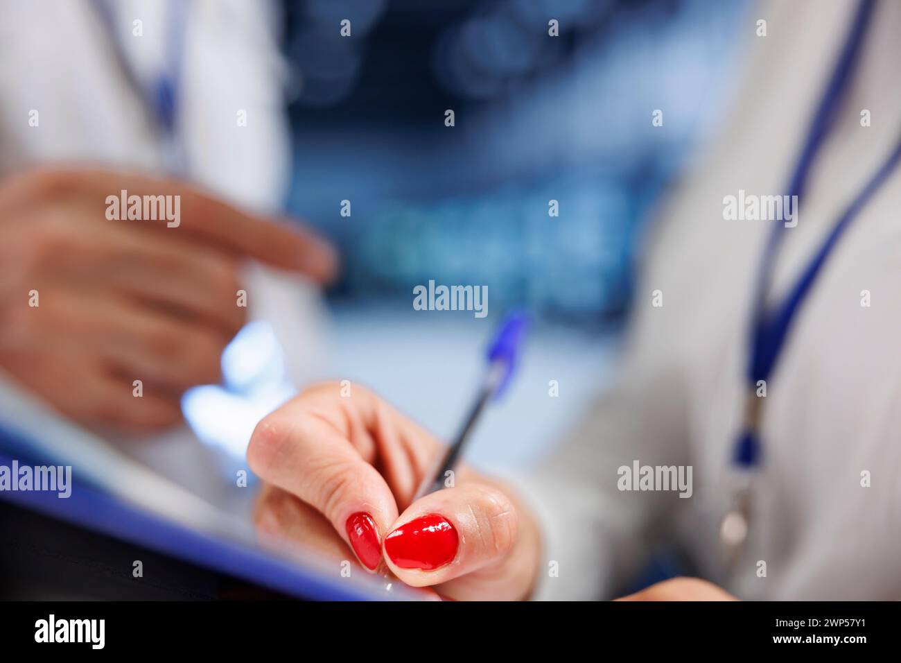 Servicemen performing diagnostic assessment on server rows to detect ...