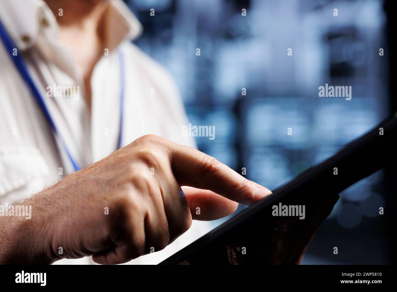Qualified Electrician Inspects Server Rows In Computer Network Security Data Center Ensuring