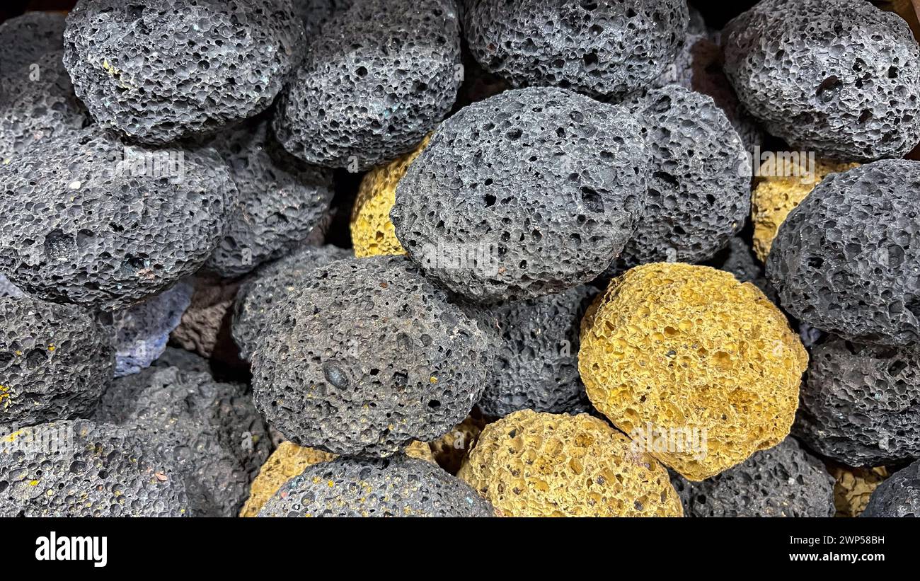 Set of colored natural pumice stones on a stall in a spice bazaar on ...