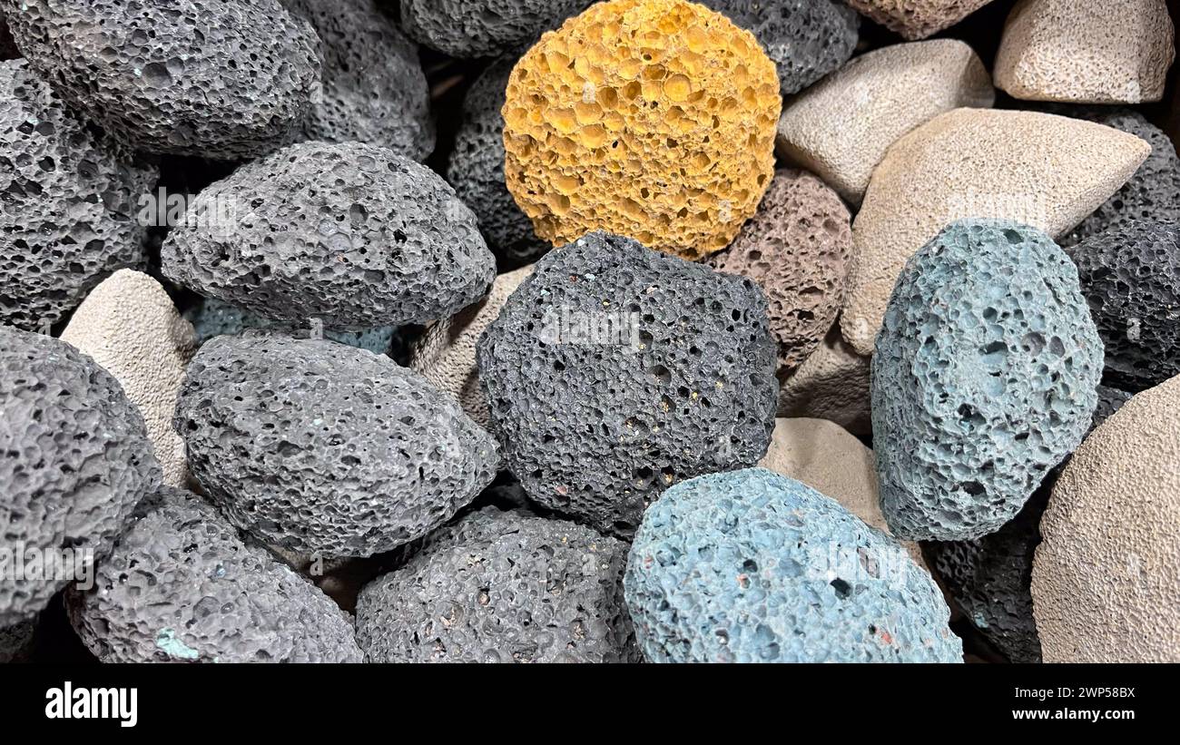 Set of colored natural pumice stones on a stall in a spice bazaar on ...