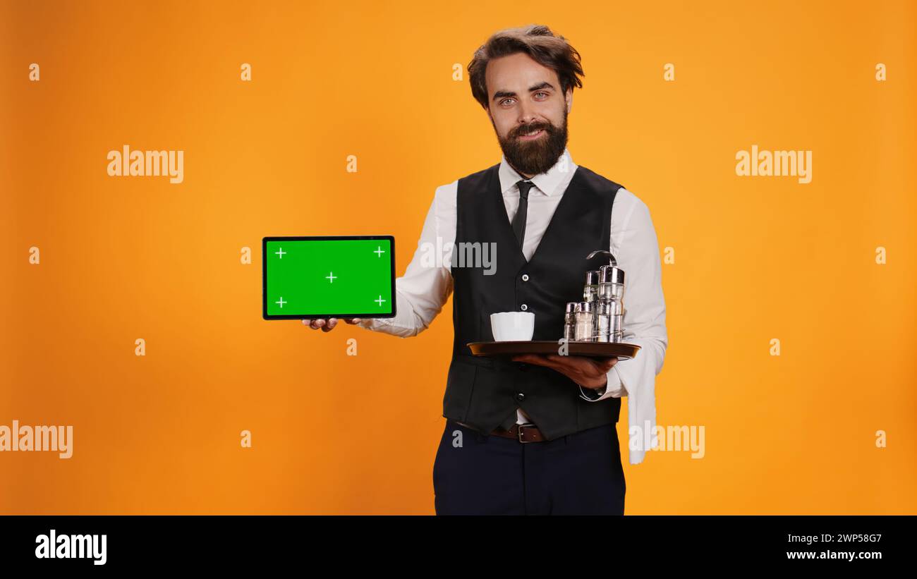 Employee shows greenscreen on tablet hi-res stock photography and ...