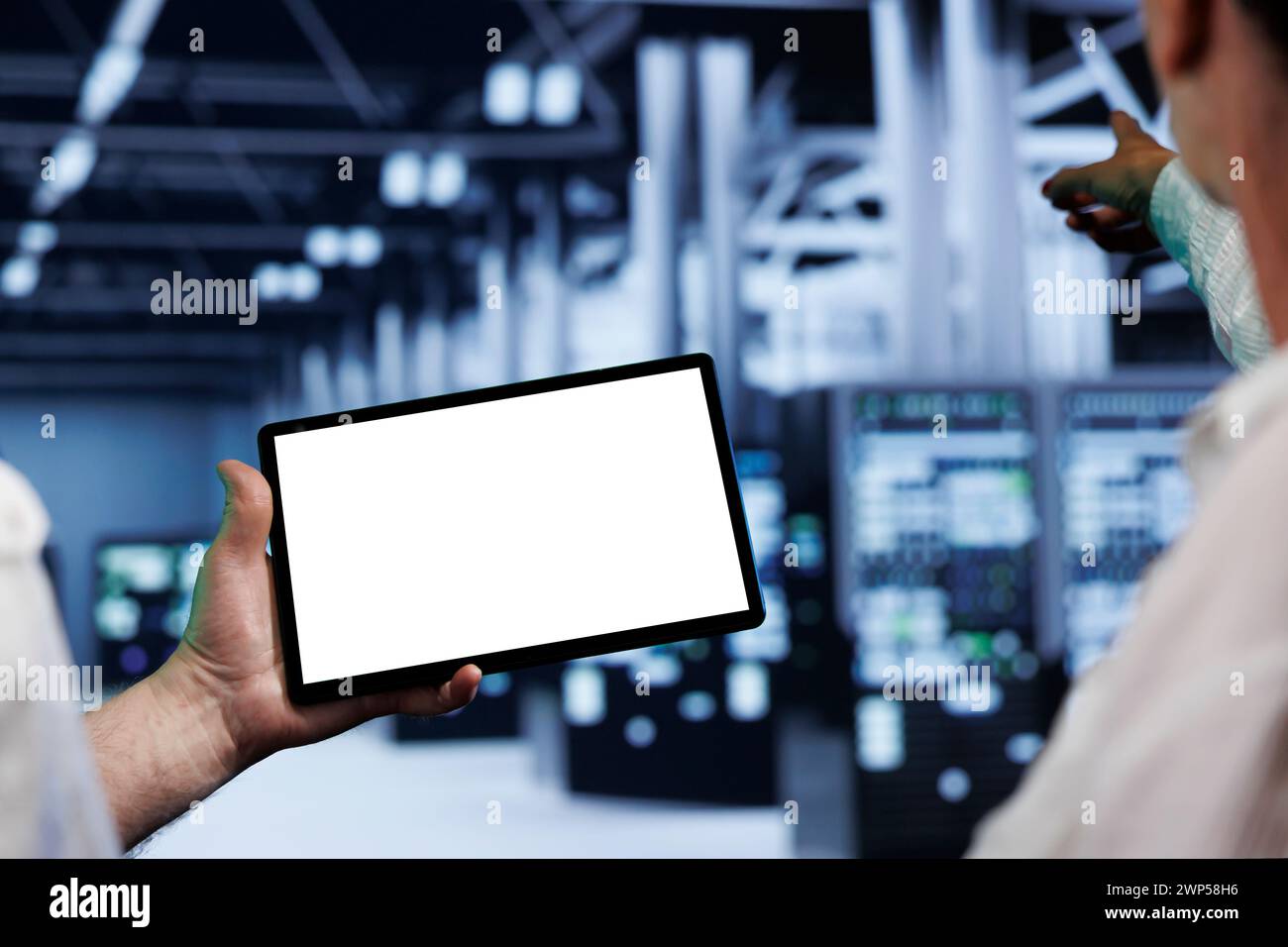 Old Coworkers In High Tech Location Using Mock Up Tablet To Set Up