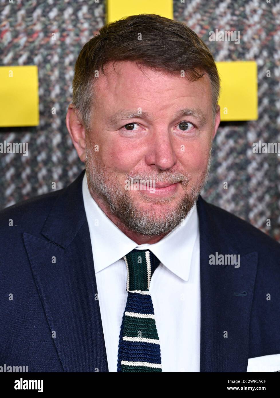 London, UK. March 5th, 2024. Guy Ritchie arriving at The Gentlemen UK ...