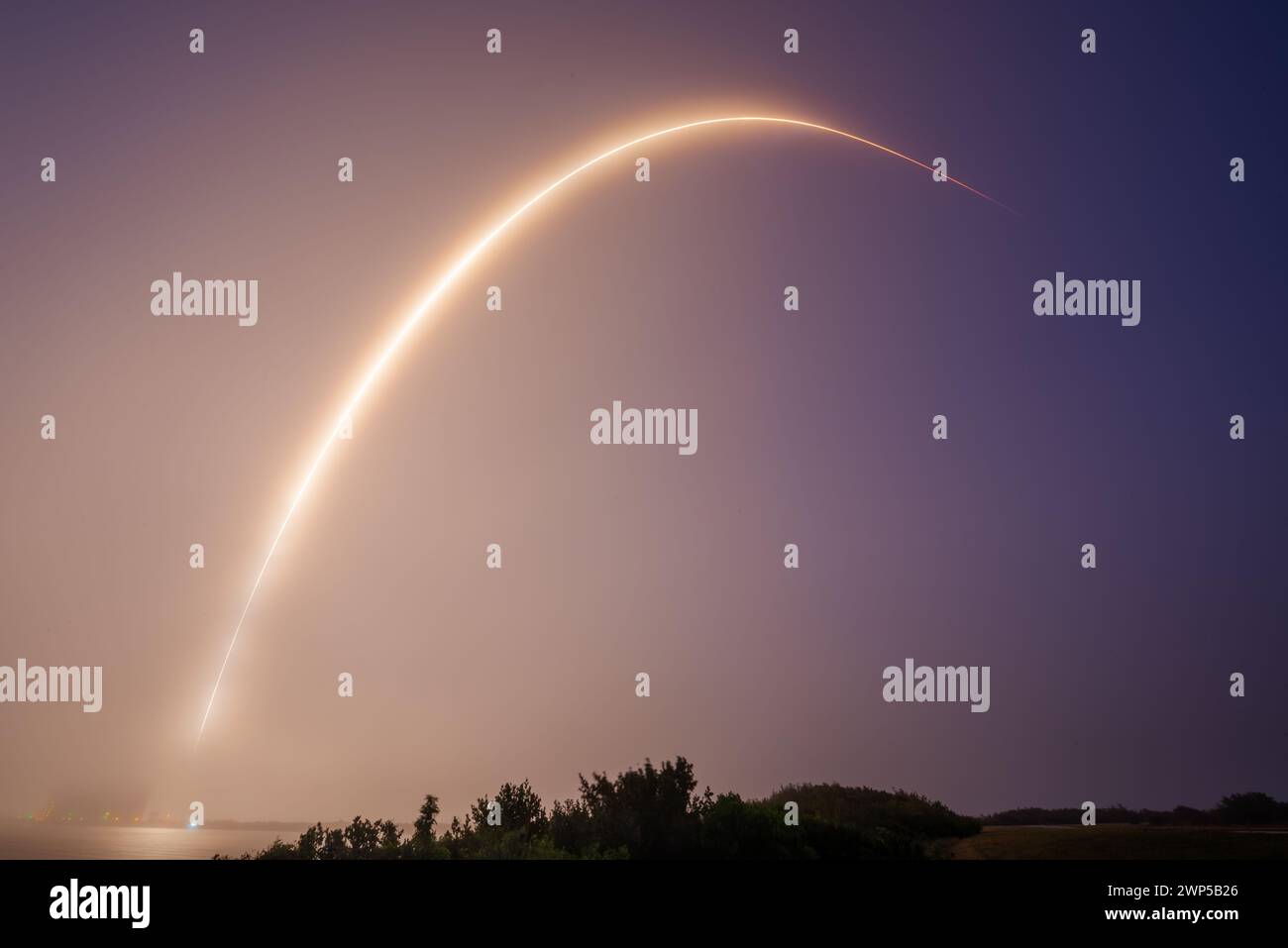 A Falcon 9 rocket carrying 23 Starlink satellites launches from Space ...