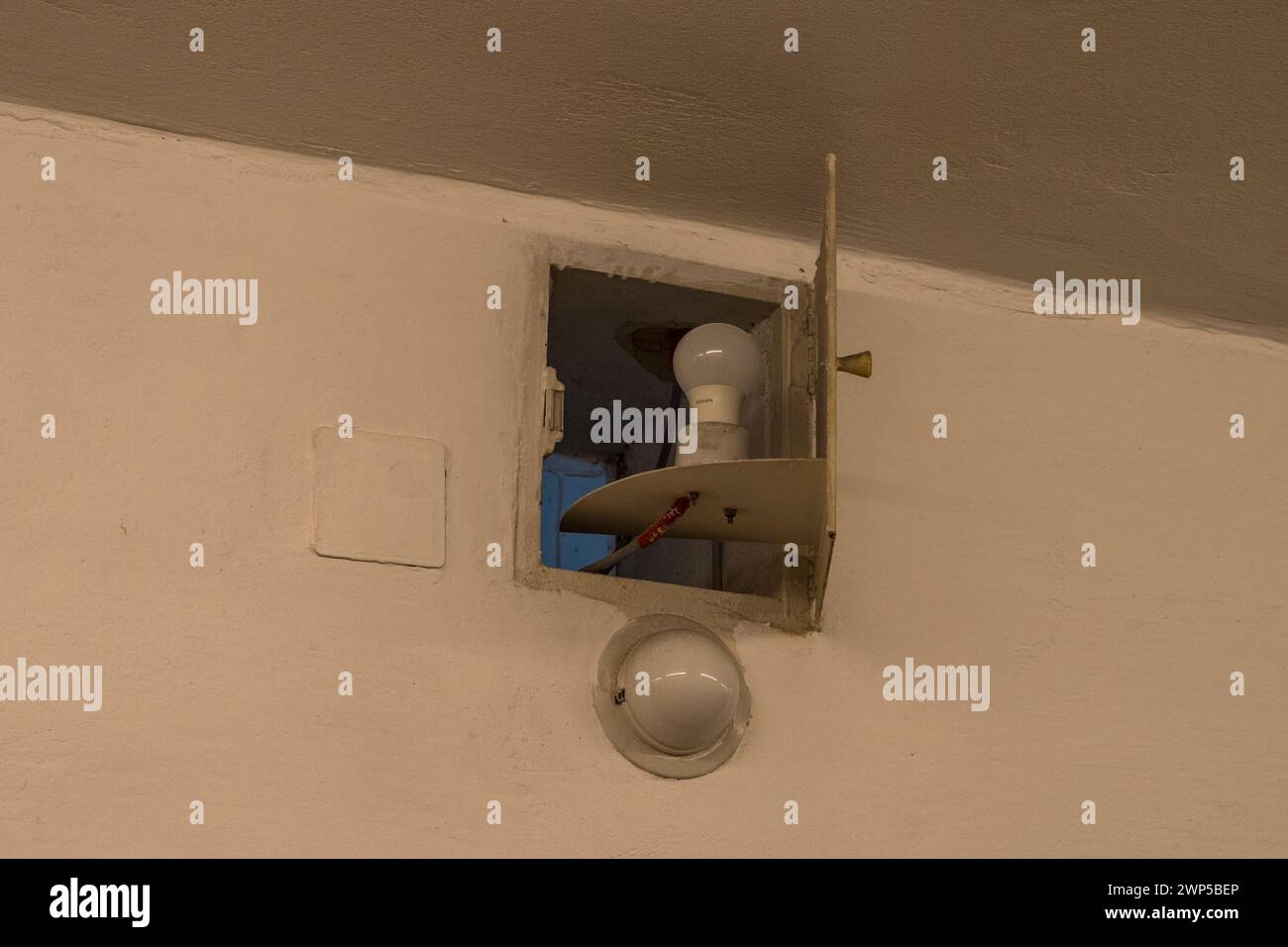 Cell light on a small trap door in the cell wing in the former Cold War ...