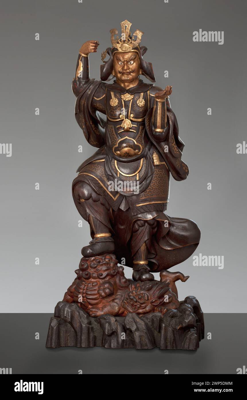A Japanese figurine depicting Bishamonten subdued by the demons of ...