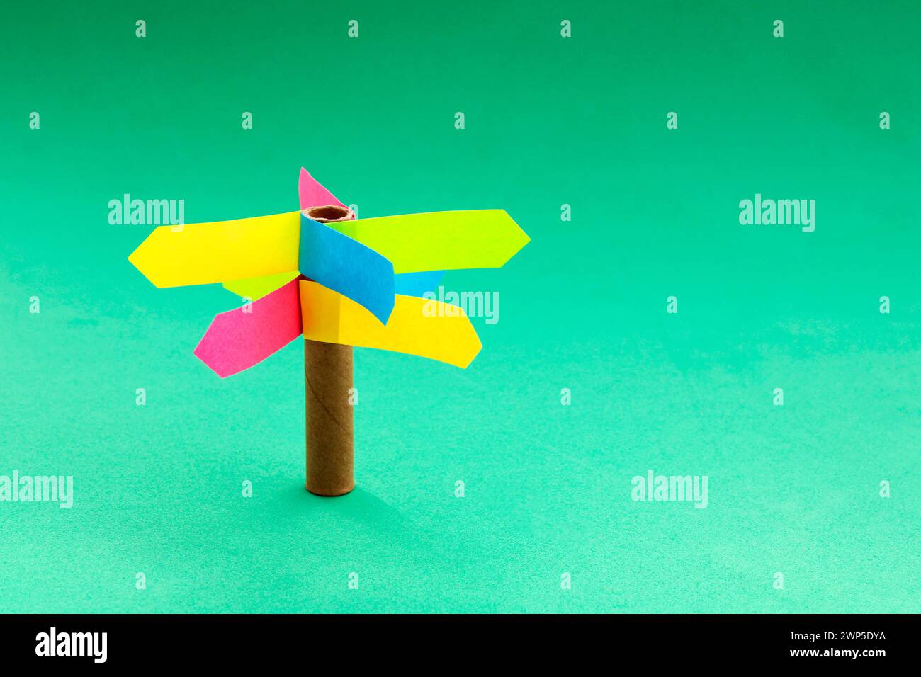 Colorful sign indicating eight different directions Stock Photo - Alamy