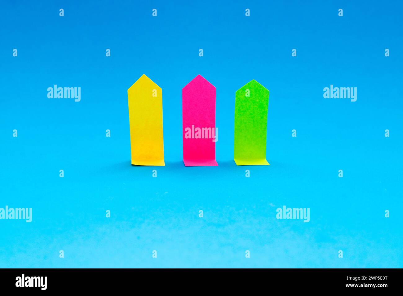 Three notes of different colors pointing in an upward direction Stock ...